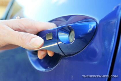 What Is That Tiny Button on the Car Door Handle?